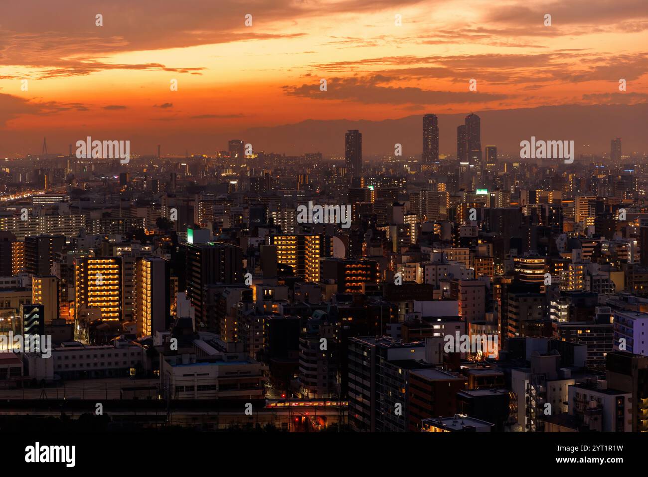 Osaka city skyline, brightly illuminated by vibrant and colorful lights ...