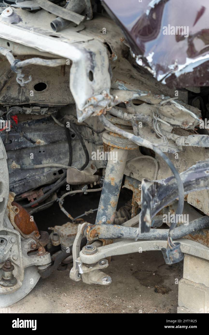 A passenger car is parked in the parking lot with damage to the right ...