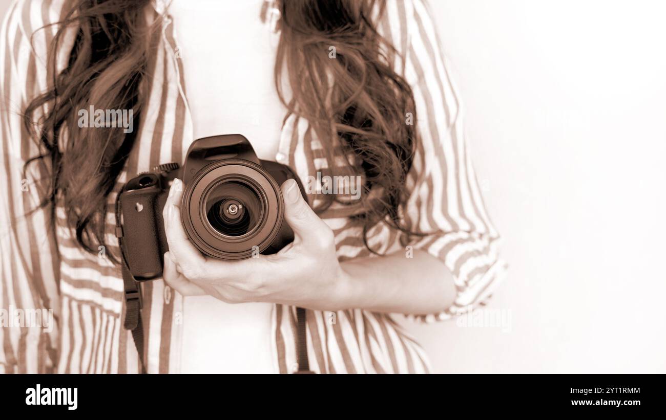 Photographer holding dslr camera. Self portrait, front view. Colour of ...
