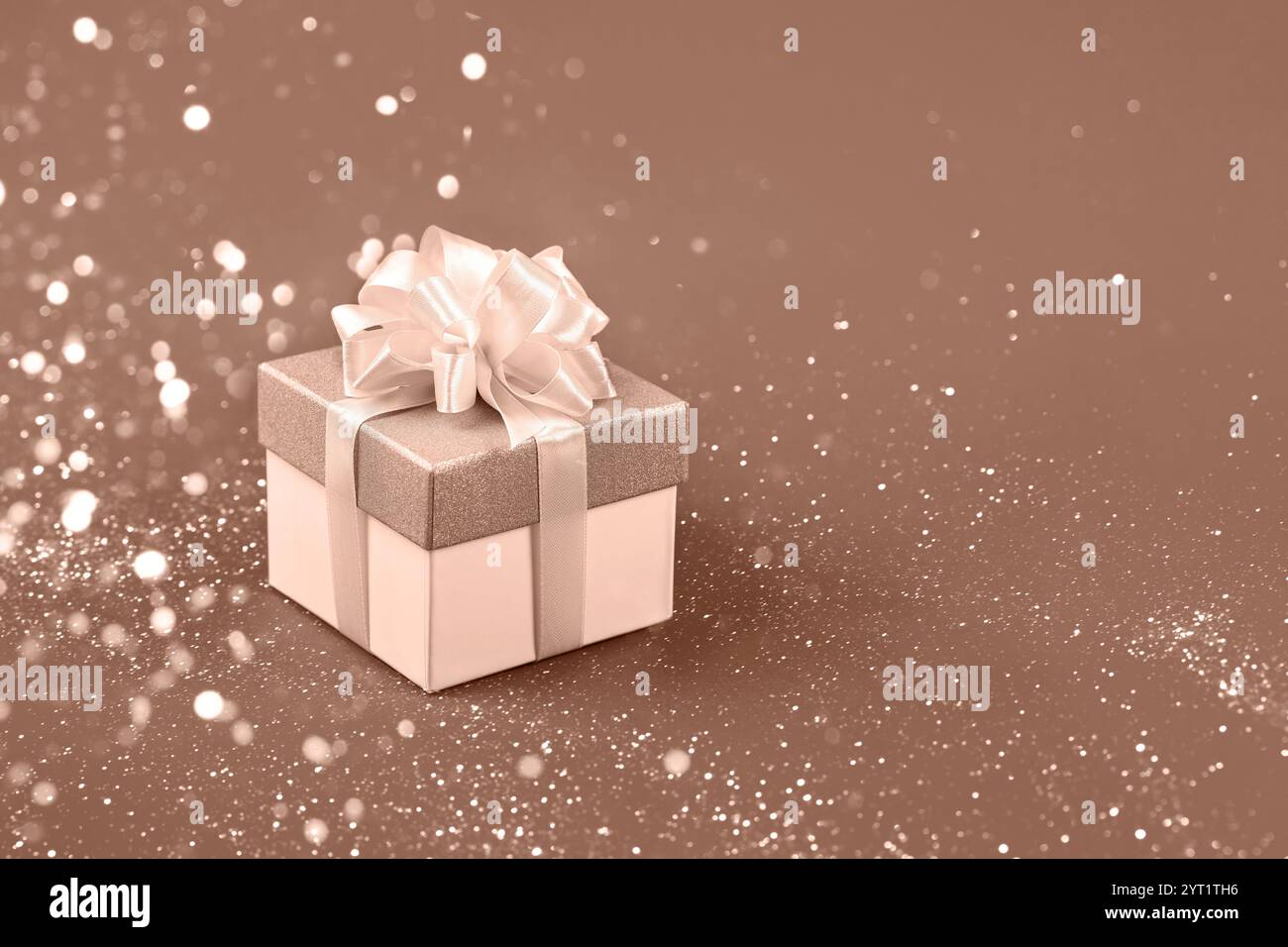 Gift box with a satin ribbon bow for holiday. Demonstrating the colors ...