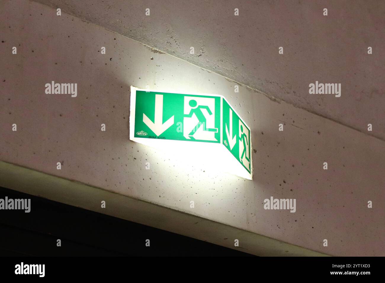 Illuminated Emergency Exit Sign in Modern Indoor Setting Stock Photo ...