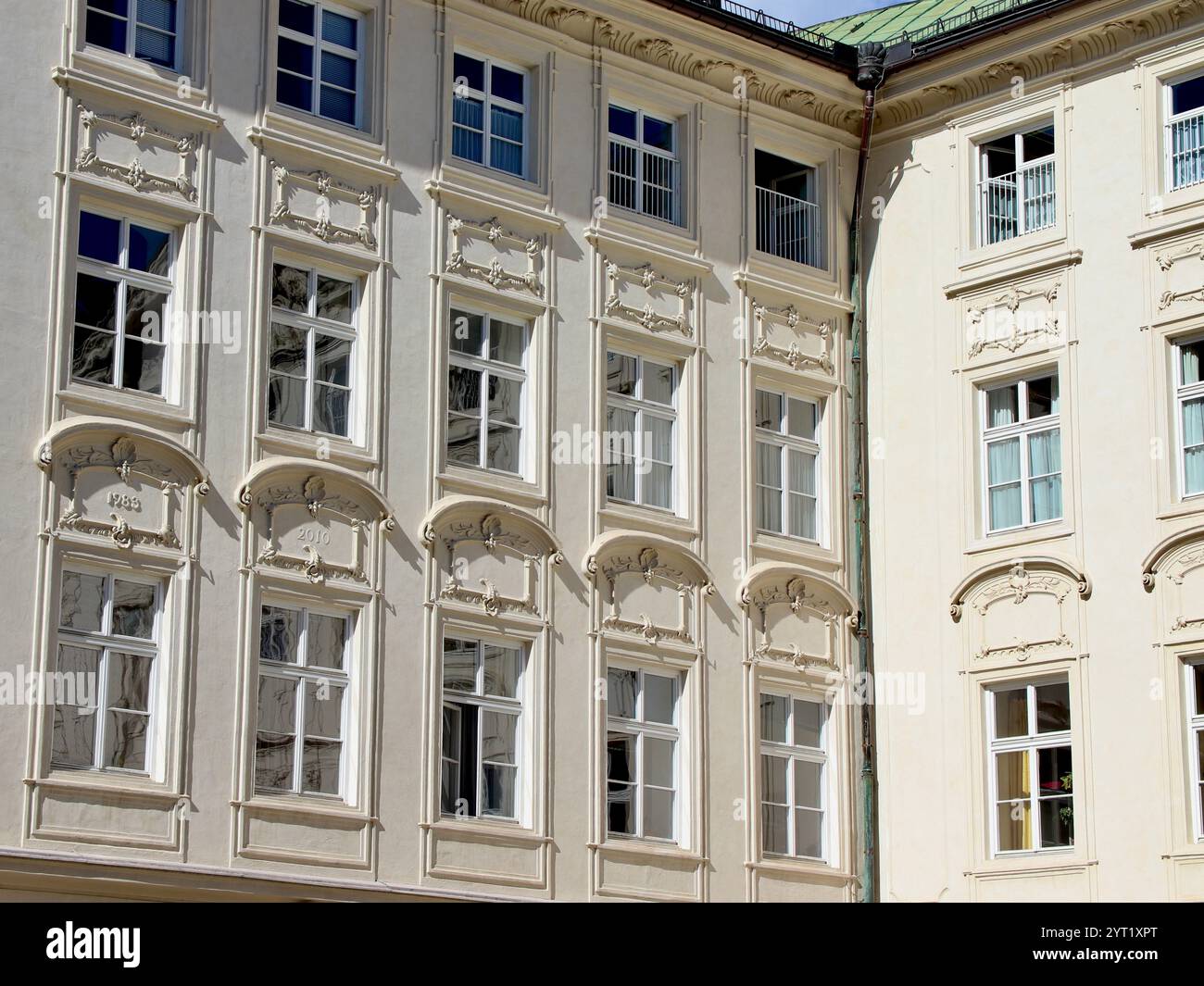 Baroque-Style Building Facade with Ornate Moldings and Symmetrical ...