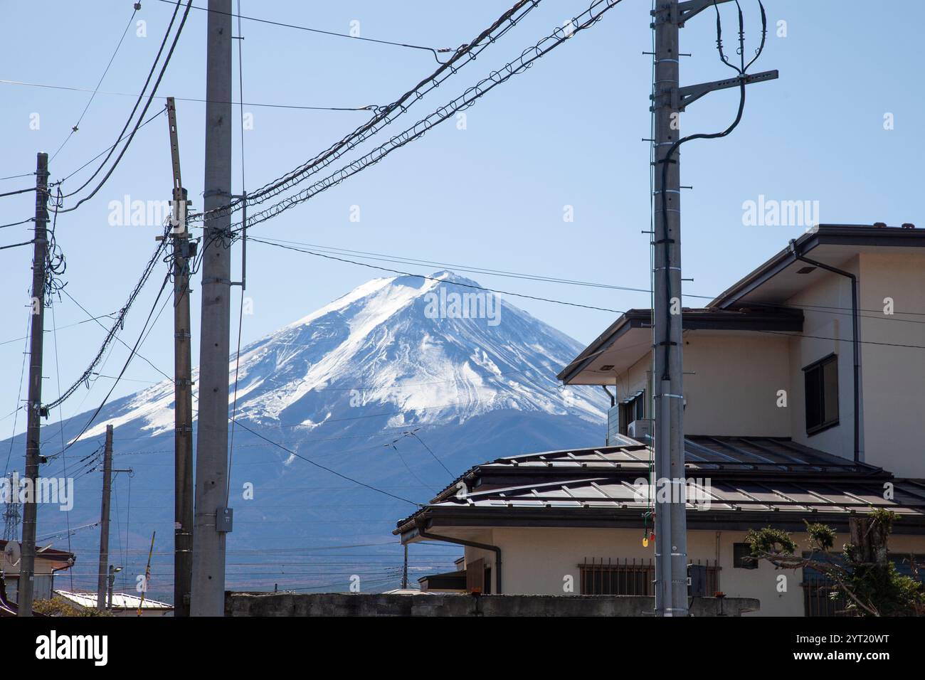 View of Mount Fuji.between telegraph poles and overhead cables near ...