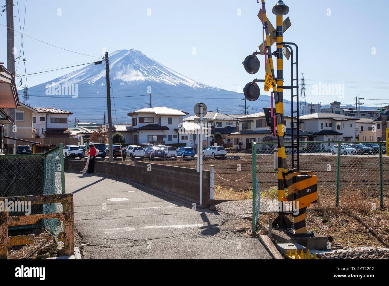 Small road and train crossing near Kawaguchiko Station in Yamanashi ...