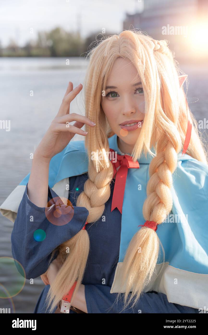 A beautiful teenage girl cosplayer dressed as a Japanese Anime ...