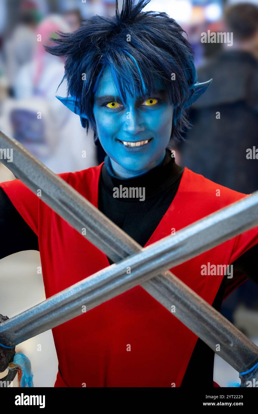 A pretty girl cosplayer dressed as the blue Mutant Bamf from the X-Men ...