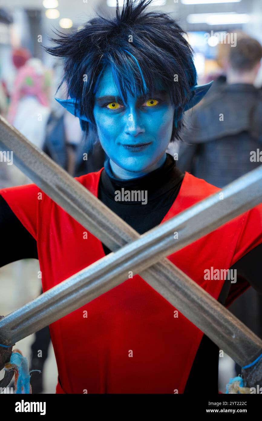 A pretty girl cosplayer dressed as the Mutant Bamf from the X-Men ...