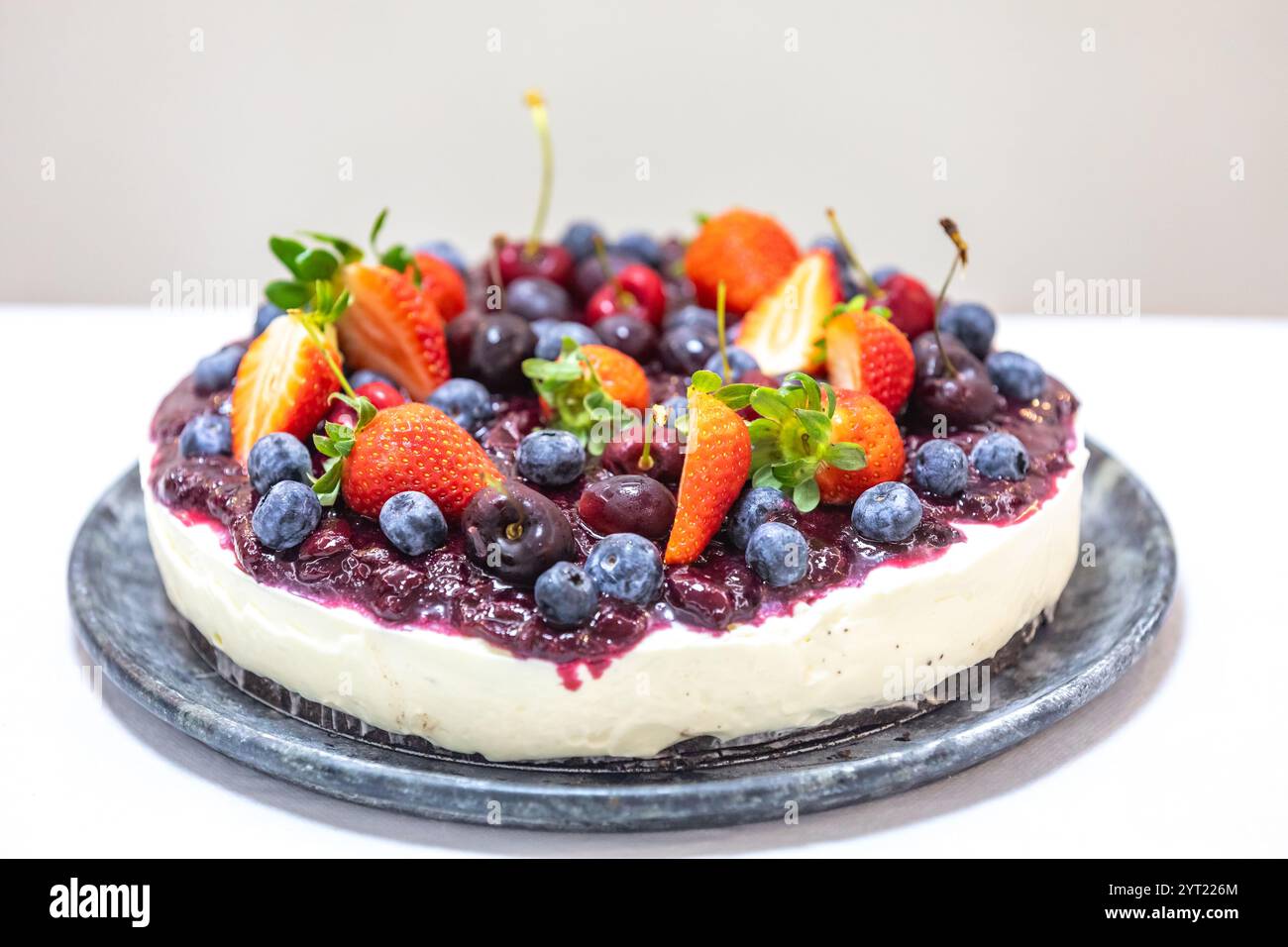 Traditional Christmas red fruit cheesecake with creative and luxurious ...