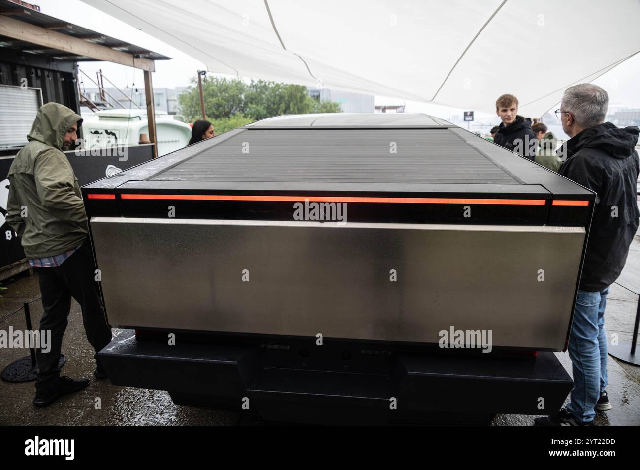 People seen inspecting a Tesla Cybertruck Odyssey from U.S. billionaire ...