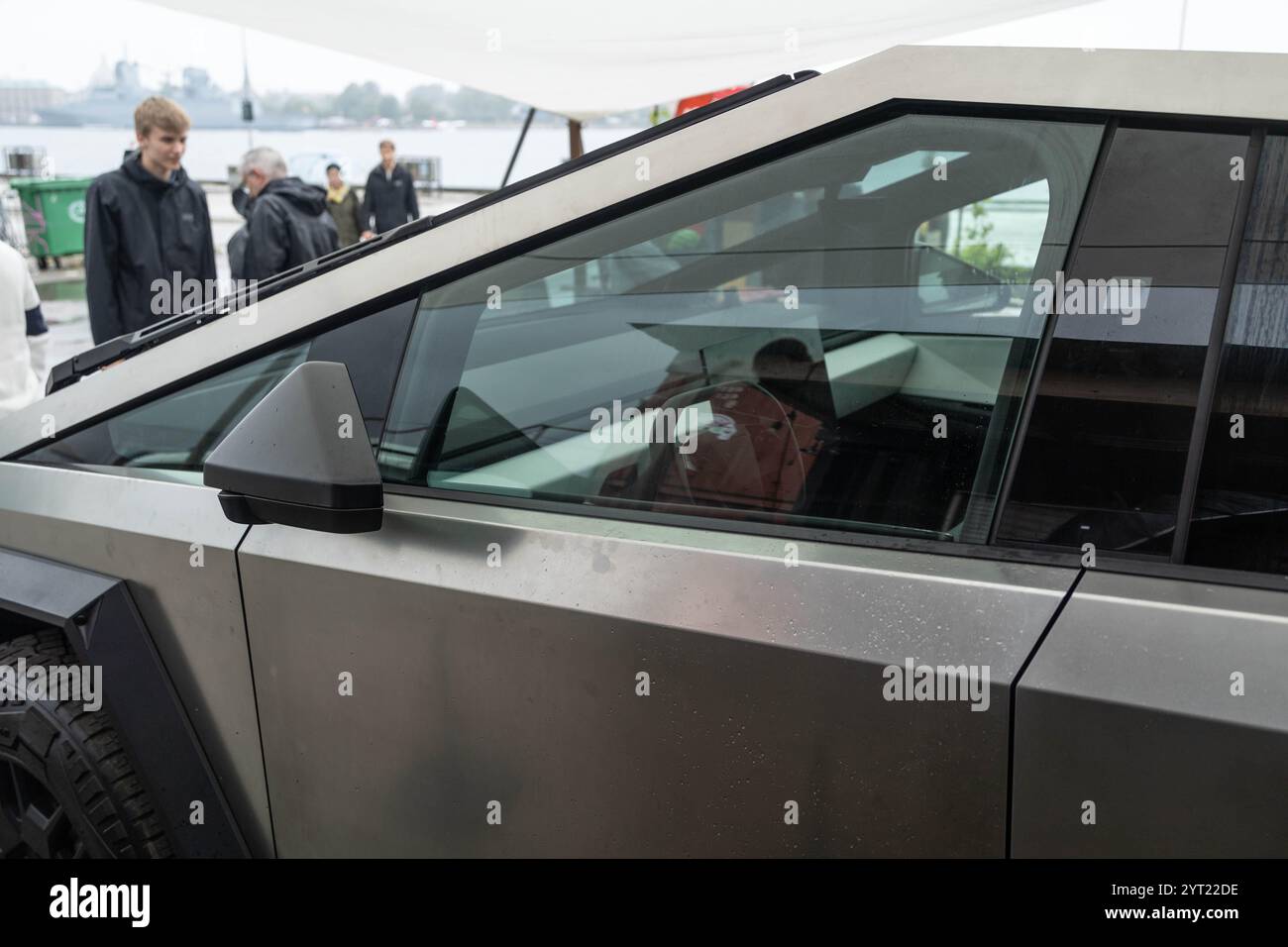 People seen inspecting a Tesla Cybertruck Odyssey from U.S. billionaire ...