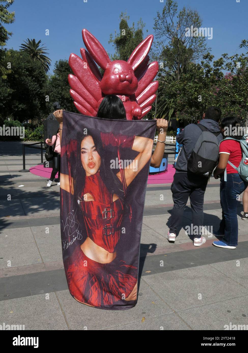 Fan Nohemi Cruz poses for a photo in front of a rabbit celebrating ...