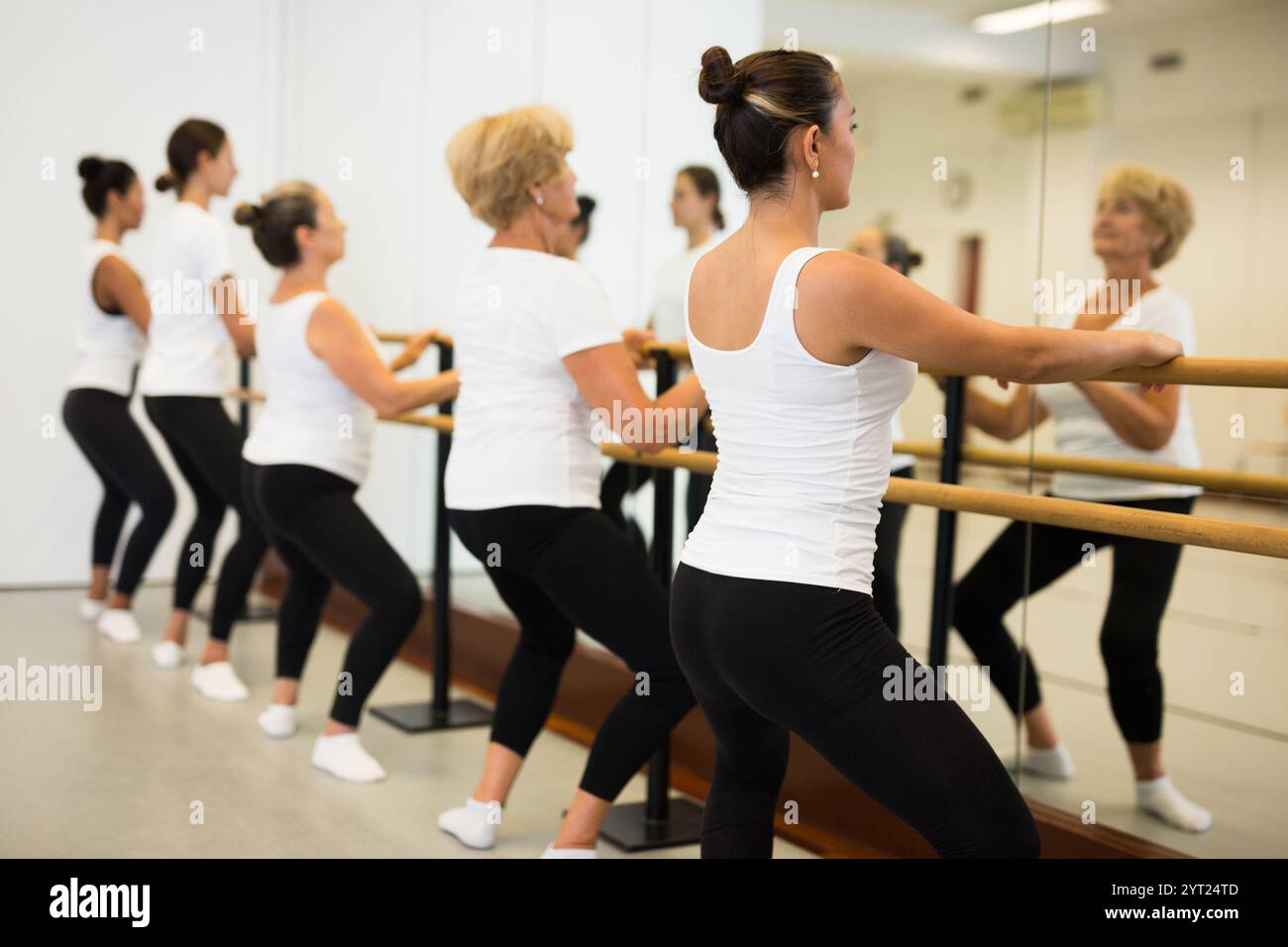 Ballet troupe of different ages in lesson in dance class Stock Photo ...