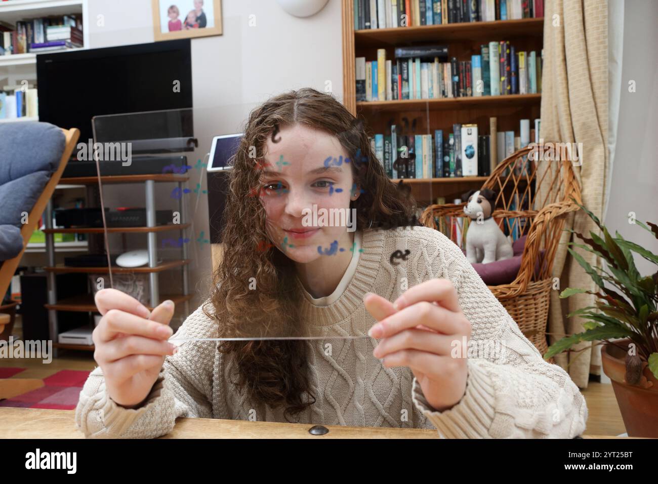 Teenage girl revising Latin on a whiteboard revision learning student ...