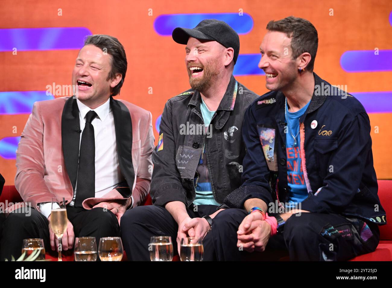 EDITORIAL USE ONLY Jamie Oliver with Jonny Buckland and Chris Martin of ...
