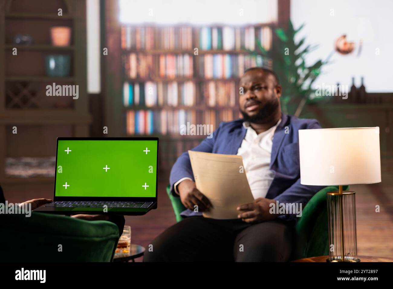 Two secret agents examine evidence at CIA secret base with a green ...