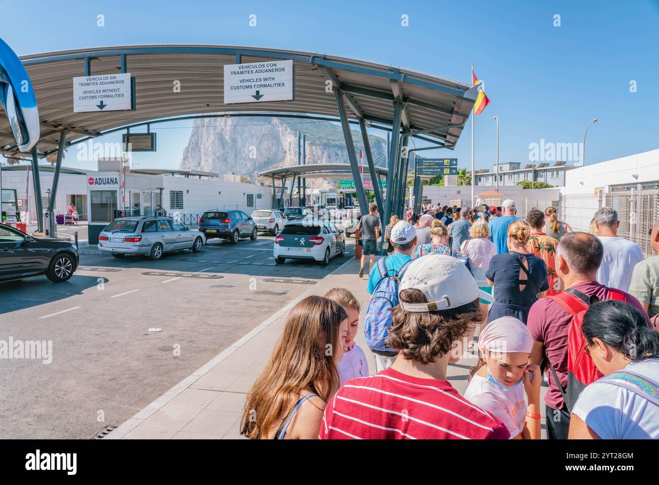 Tourists and cars queuing at Gibraltar border crossing point on sunny ...