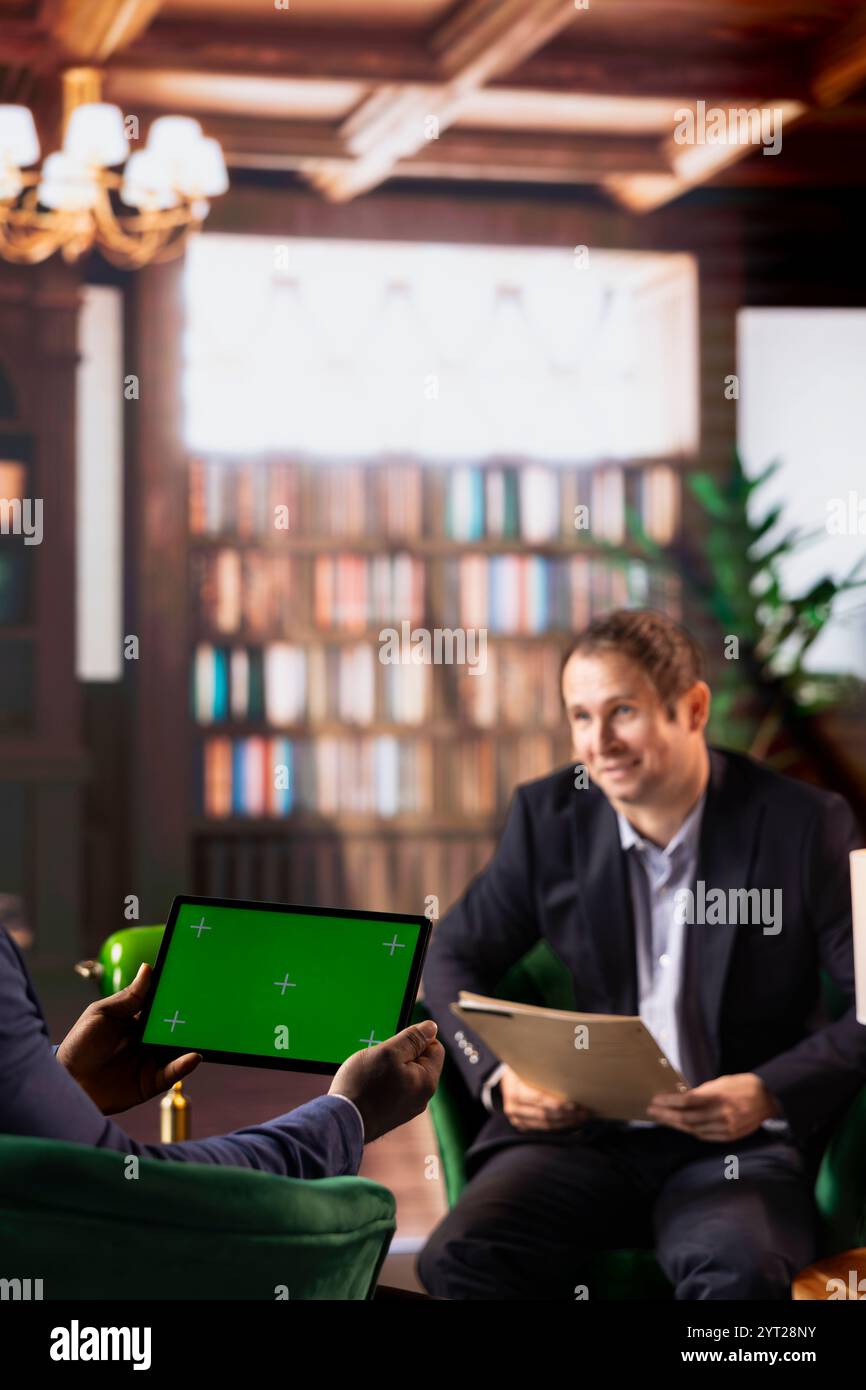 Two secret agents examine evidence at CIA secret base with a green ...