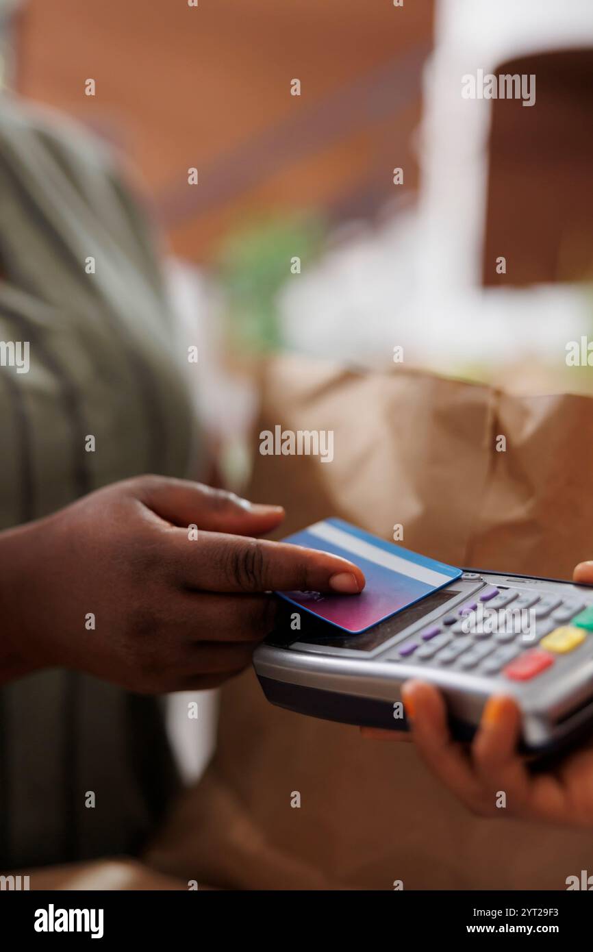 An African American woman is seen up close as she effortlessly makes a ...