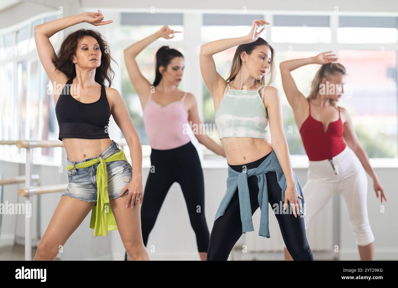 Group of modern women practicing high heels dance in studio Stock Photo ...