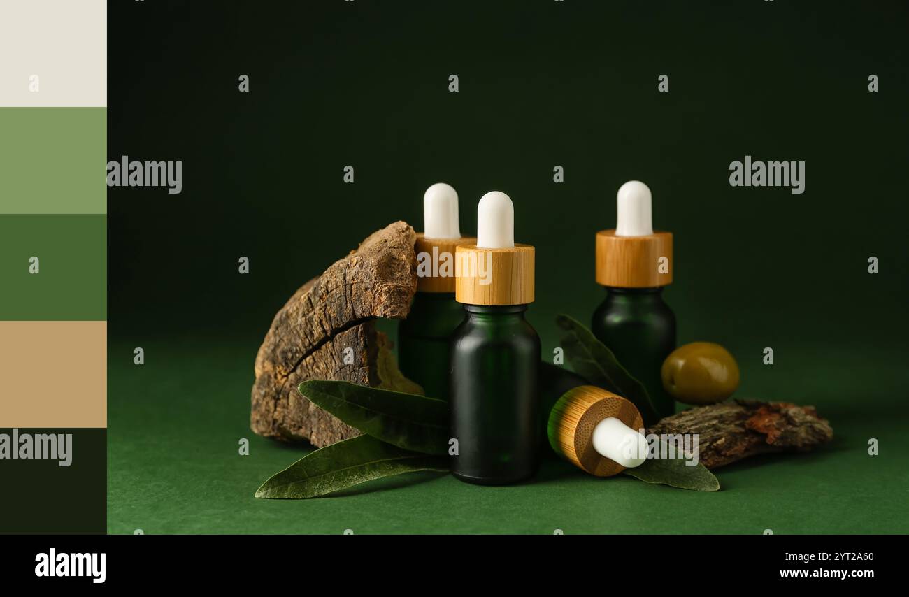 Bottles of olive essential oil on green background. Different color ...