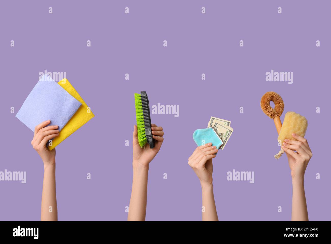Women holding cleaning supplies and wallet with money on lilac ...