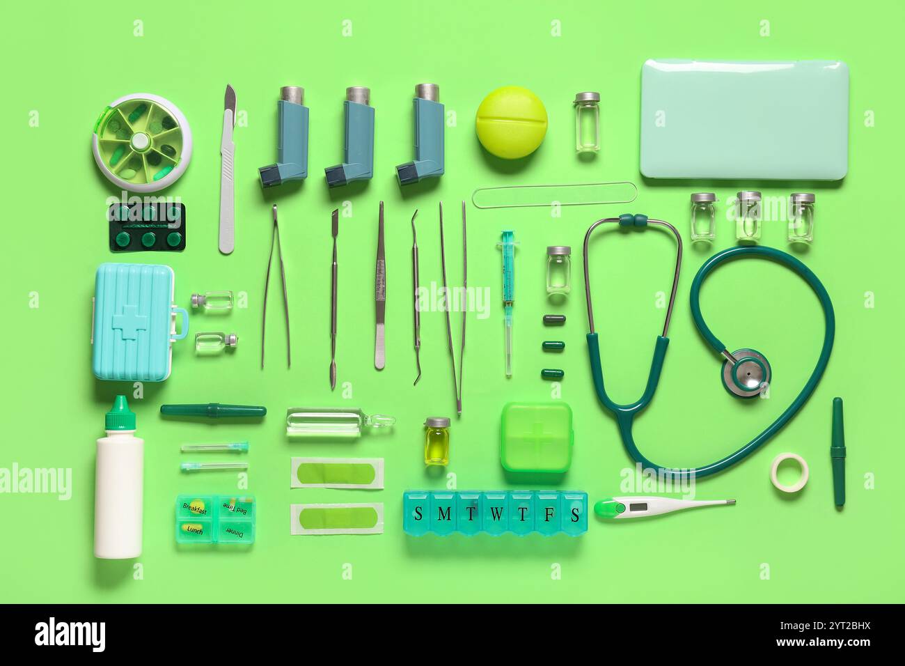 Medical supplies with stethoscope and syringe on green background. Top ...