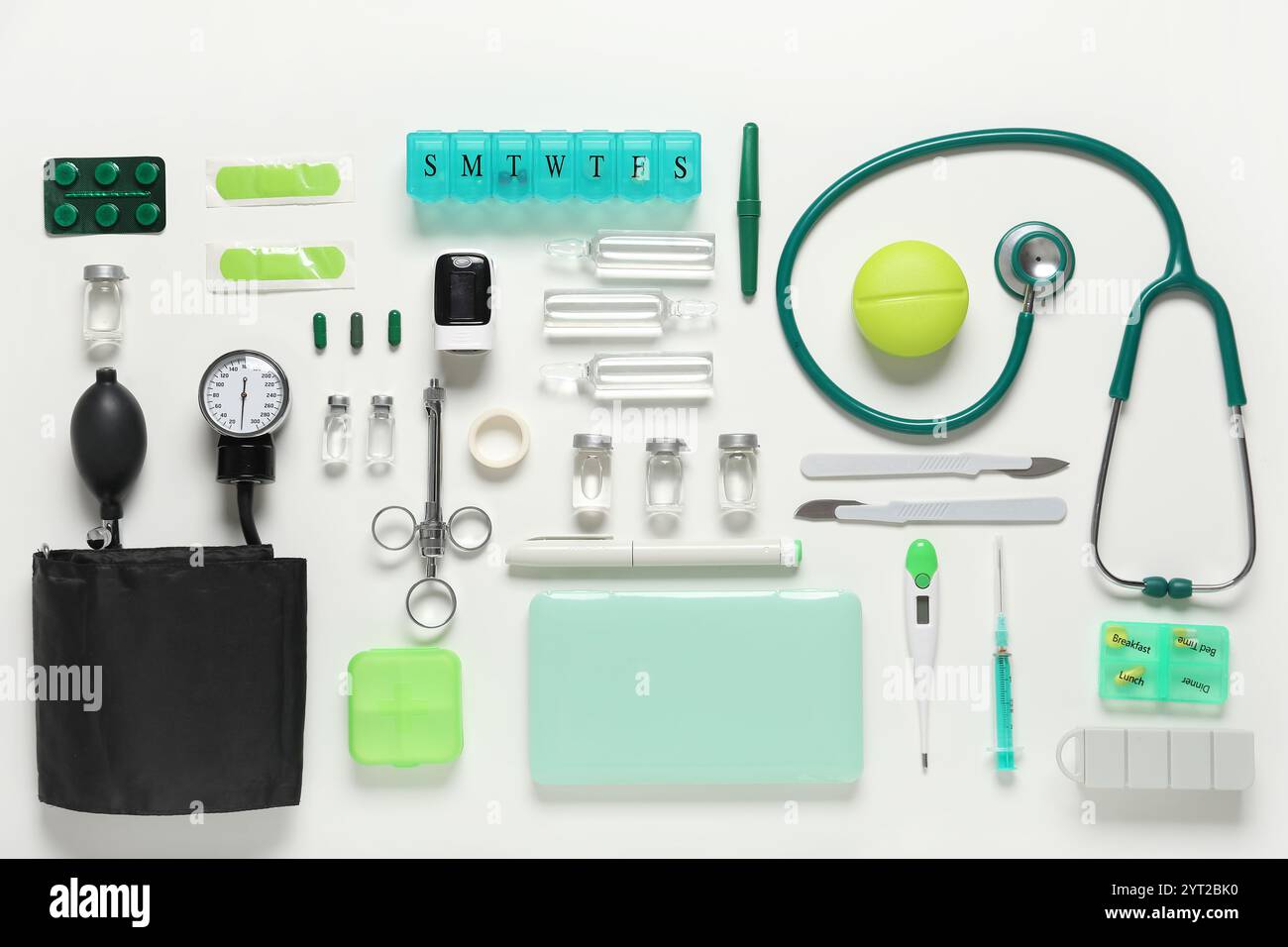 Medical supplies with stethoscope, tonometer and injections on white ...