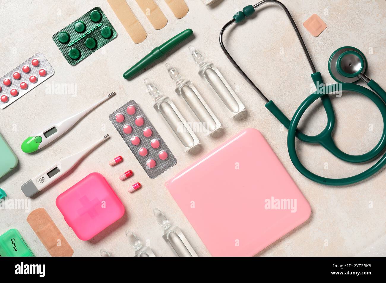 Medical supplies with stethoscope, thermometer and injections on white ...