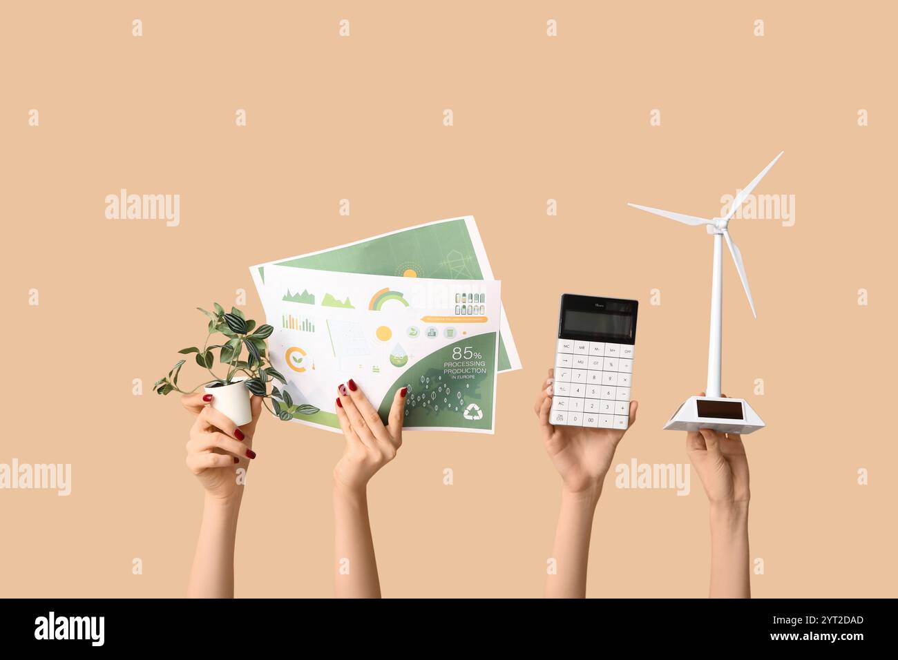 Many hands with wind turbine model, calculator and diagrams on beige ...