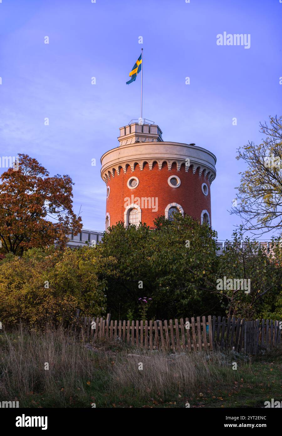 Stockholm, Sweden - 18 October 2024: A tall red brick tower with a ...