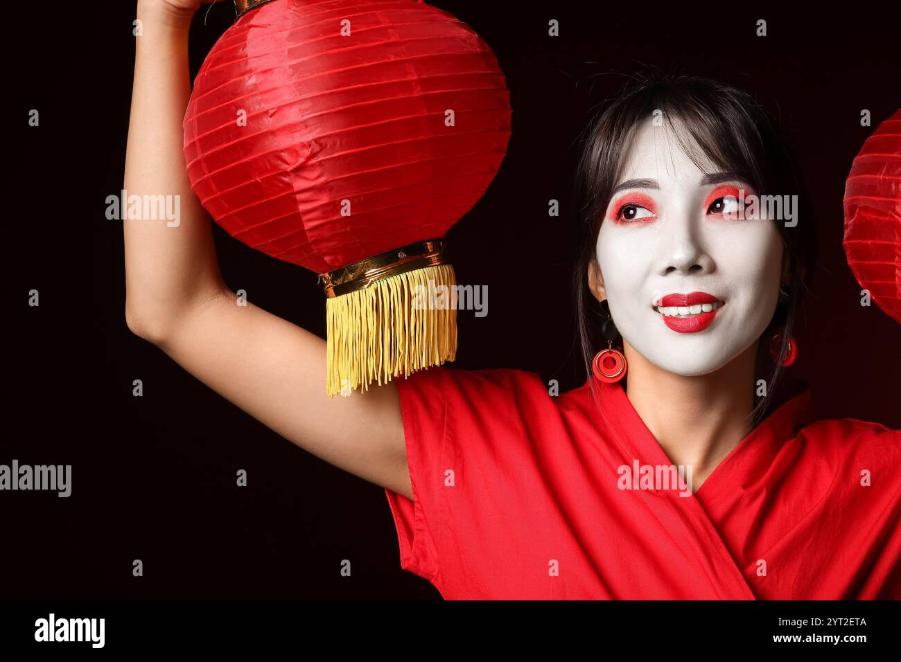 Beautiful young happy geisha in traditional clothes with lanterns on ...