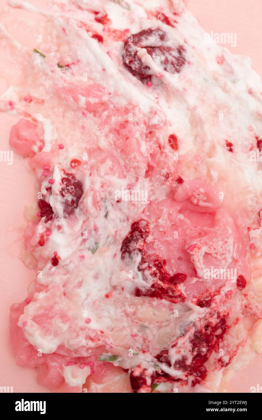 Texture of pudding, whipped cream and raspberries on pink background ...