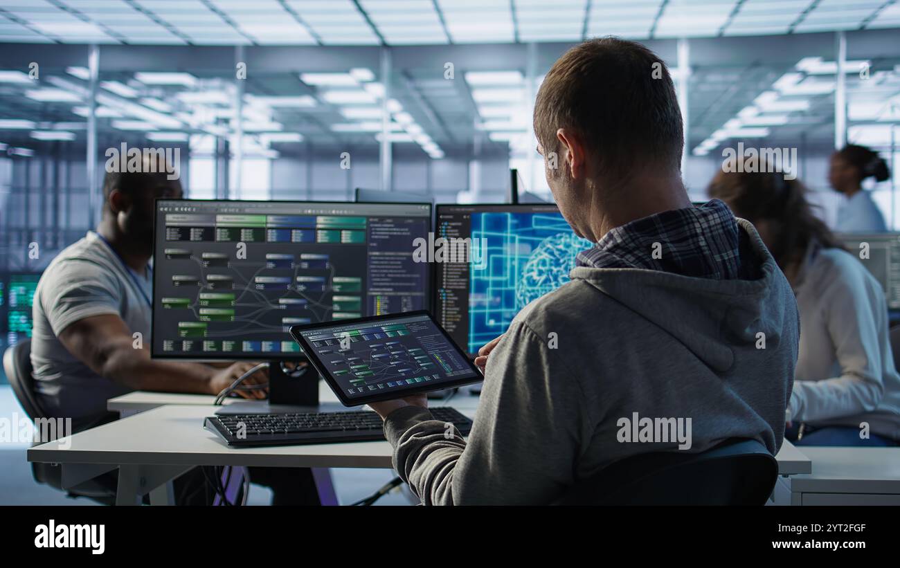 System administrator in data center solving tasks on tablet, running ... System administrator in data center solving tasks on tablet, running ...