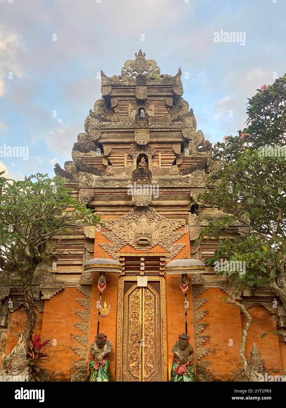 Pura Saraswati Temple Entrance with Ornate Carvings and Golden Door in ...