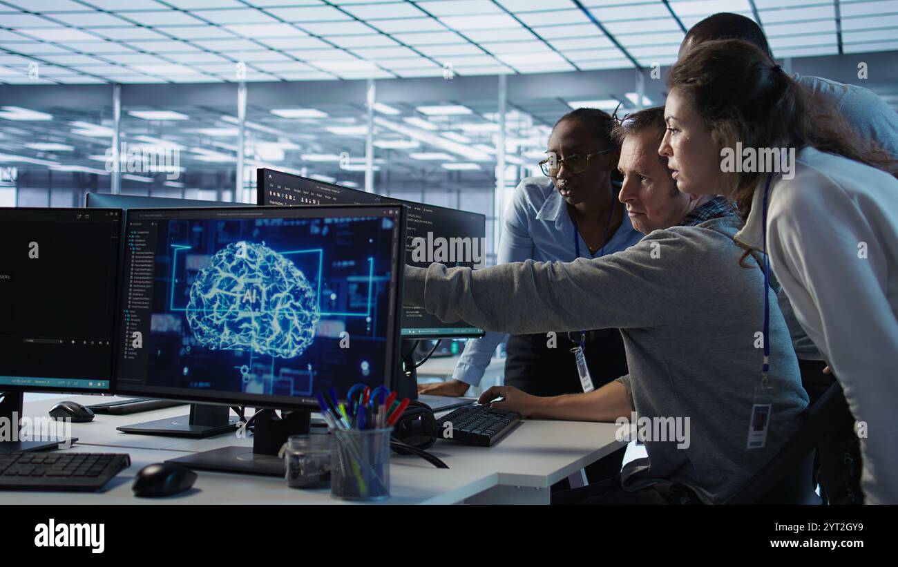 Engineer calling colleagues after finding error in code while doing checkup on server room used ...