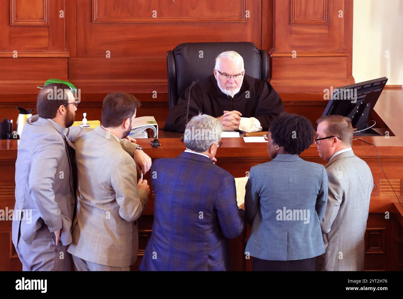 Defense attorneys and prosecutors approach Circuit Judge Kelly Luther ...