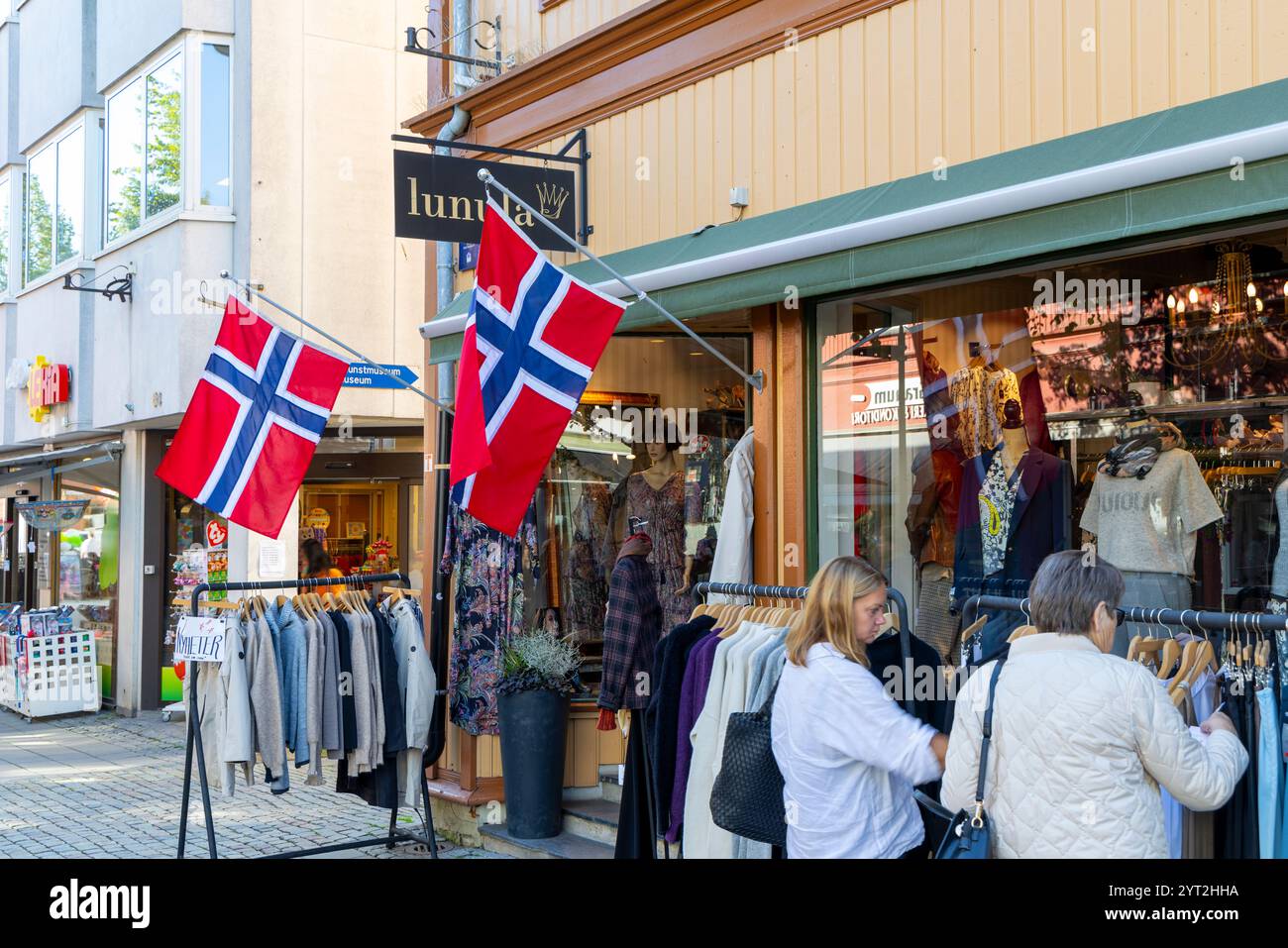 Lillehammer Norway, two middle aged ladies browsing clothing at a store ...