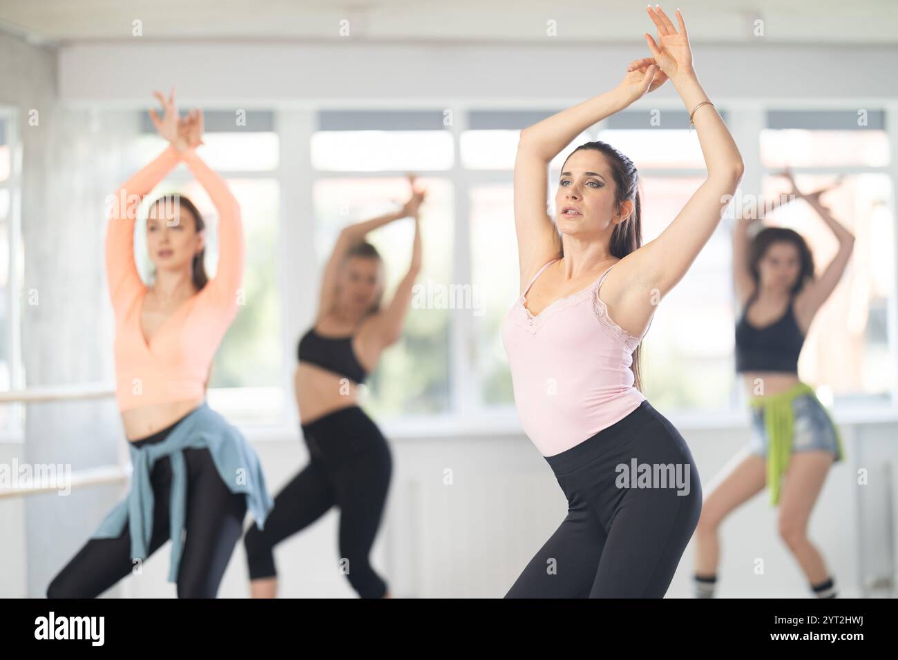 Adult woman dancing high heels in group Stock Photo - Alamy