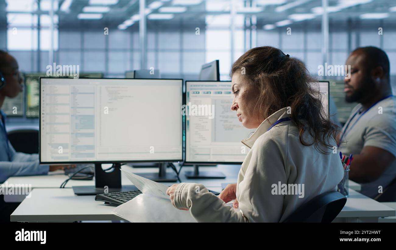 Employee overseeing server room reading hi-res stock photography and ...