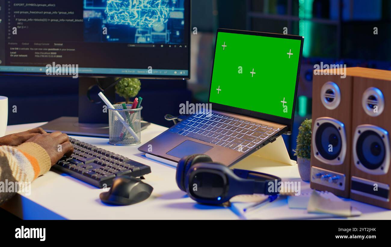 African american web developer using isolated mockup on pc and writing ...