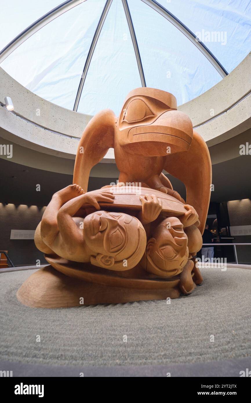 The Raven and the First Man, a circular, wood carved sculpture by Bill ...