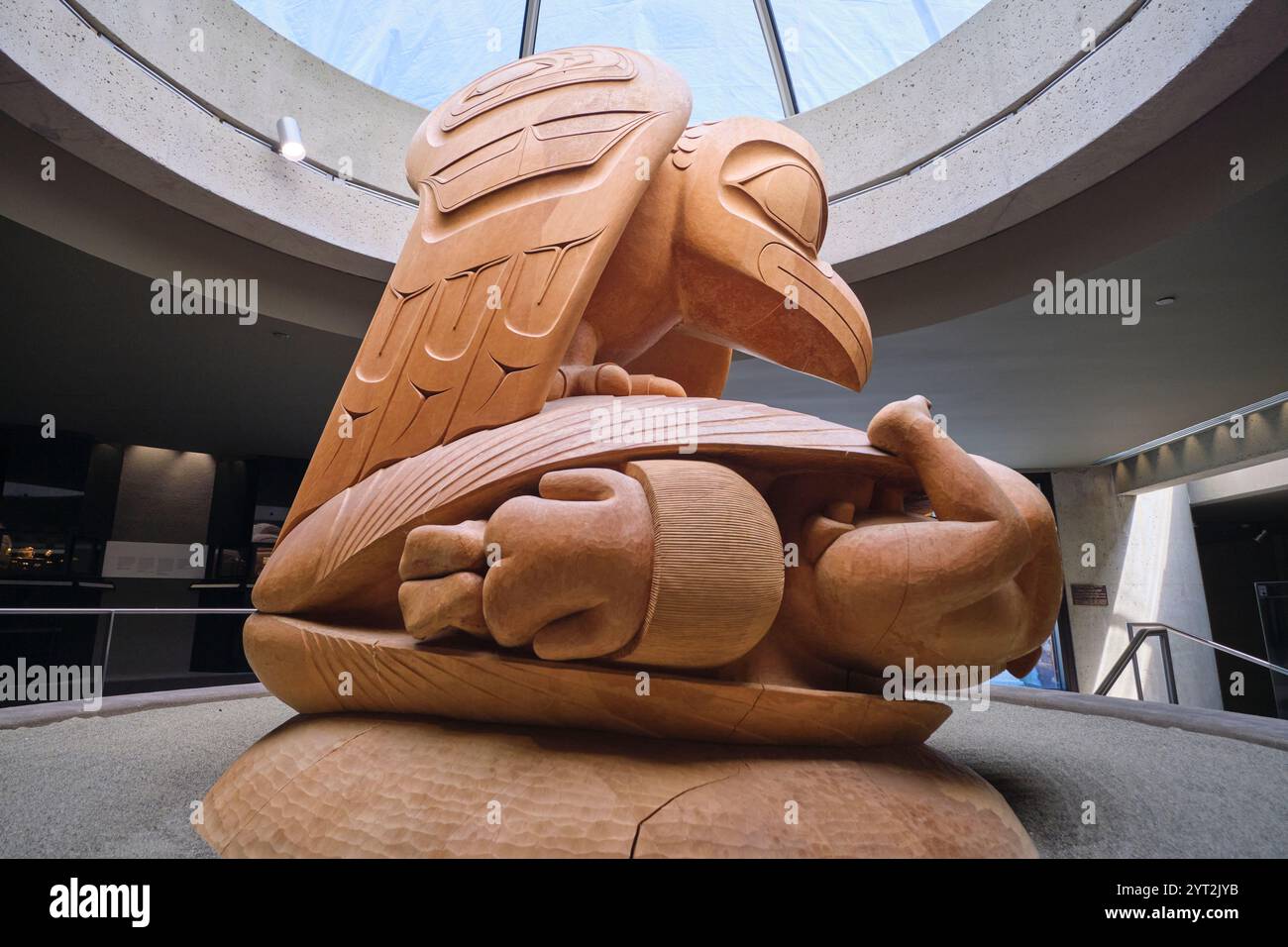 The Raven and the First Man, a circular, wood carved sculpture by Bill ...