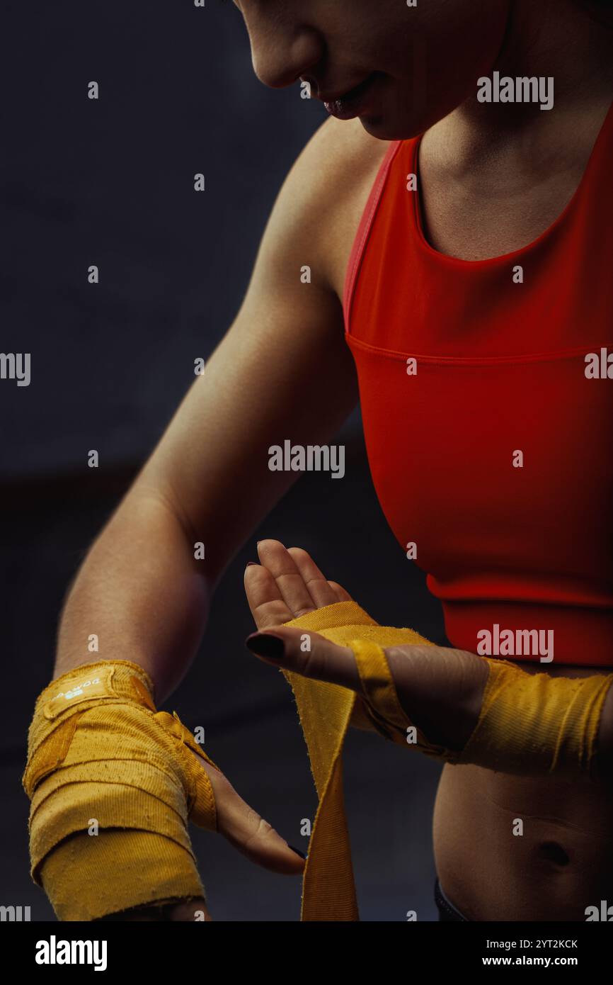 Woman wrapping hands yellow boxing hi-res stock photography and images - Alamy