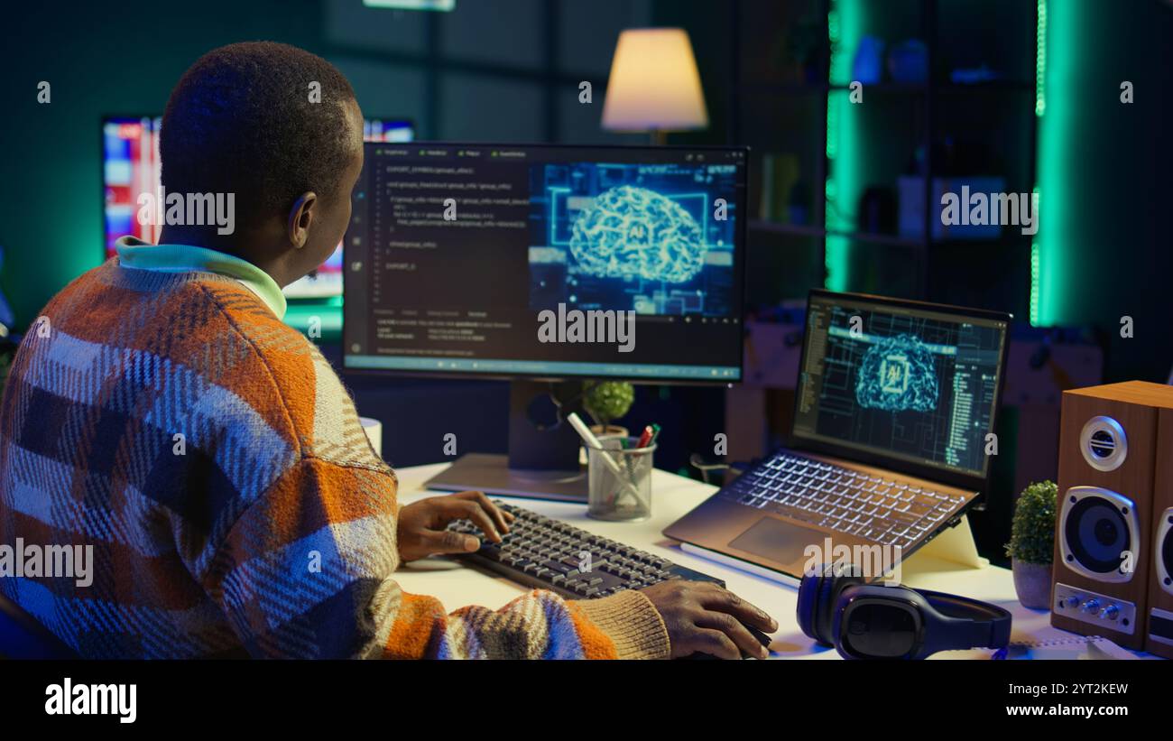 African american IT professional managing AI system for machine ...