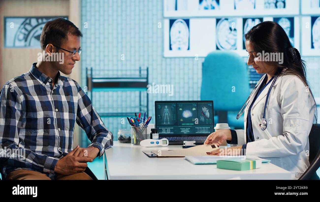 Physician meeting with patient to discuss medical test results in a ...