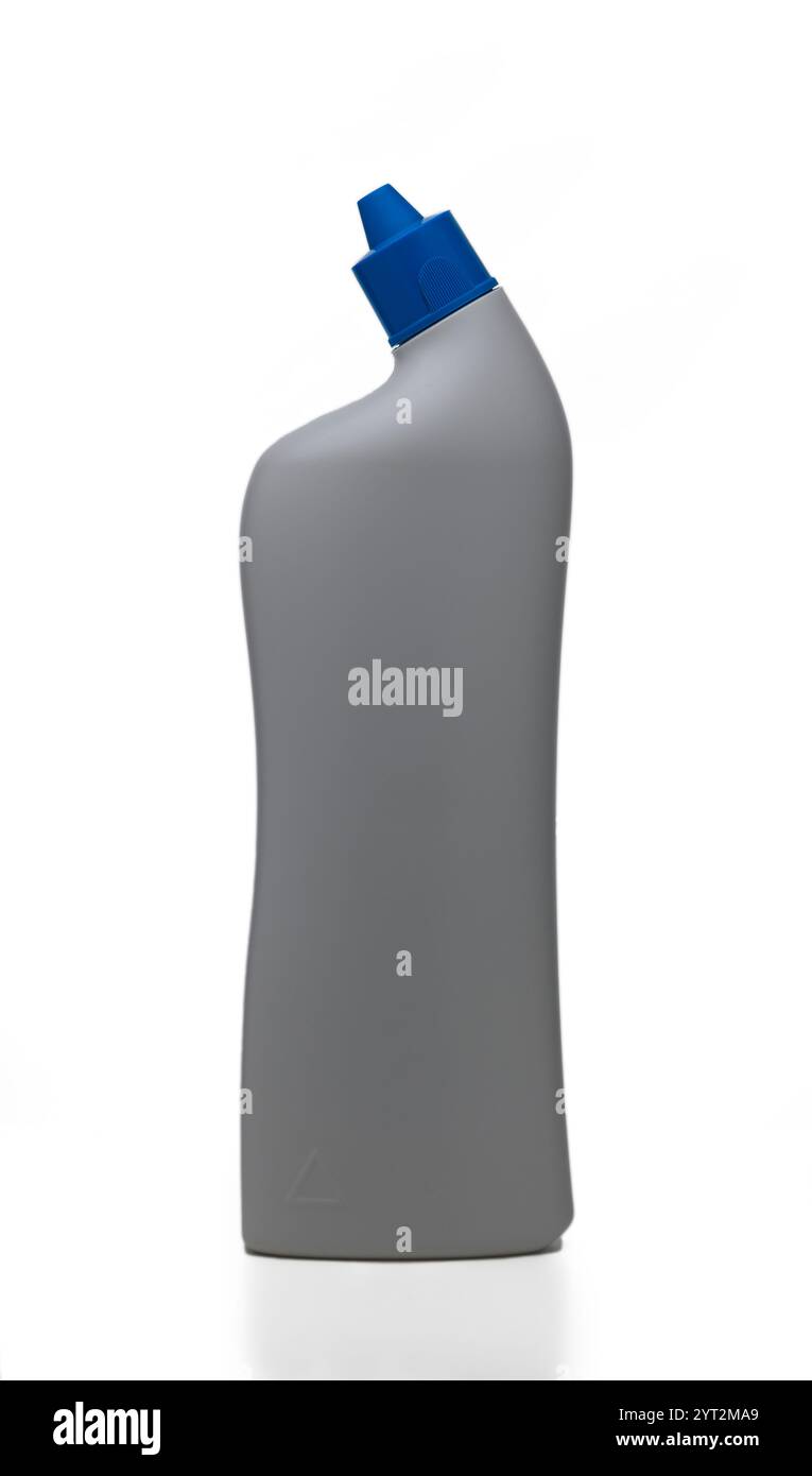 An elegantly shaped gray bottle with a blue cap stands against a plain ...