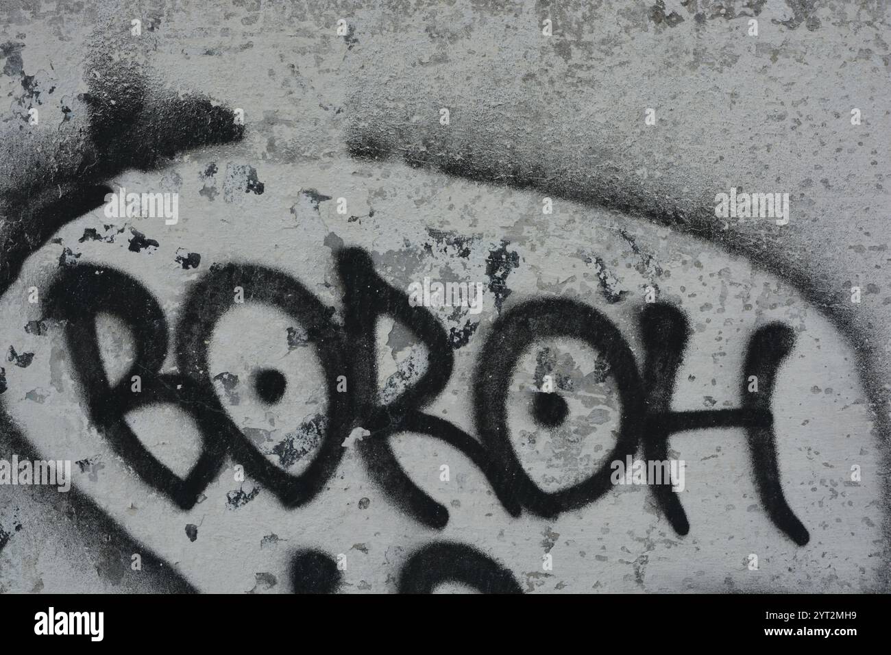 Drawings, graffiti, inscriptions on an old reinforced concrete fence ...