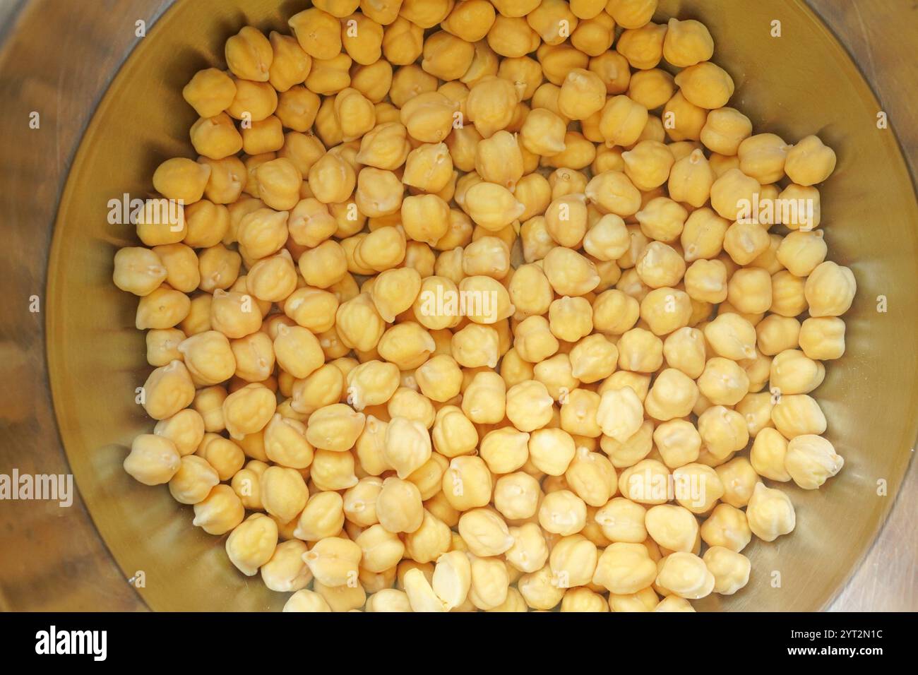 Chickpeas soaked in water Stock Photo - Alamy