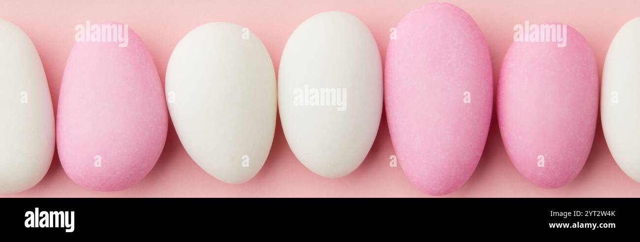 Traditional Easter Portuguese candies. White and pink sweets on pastel ...