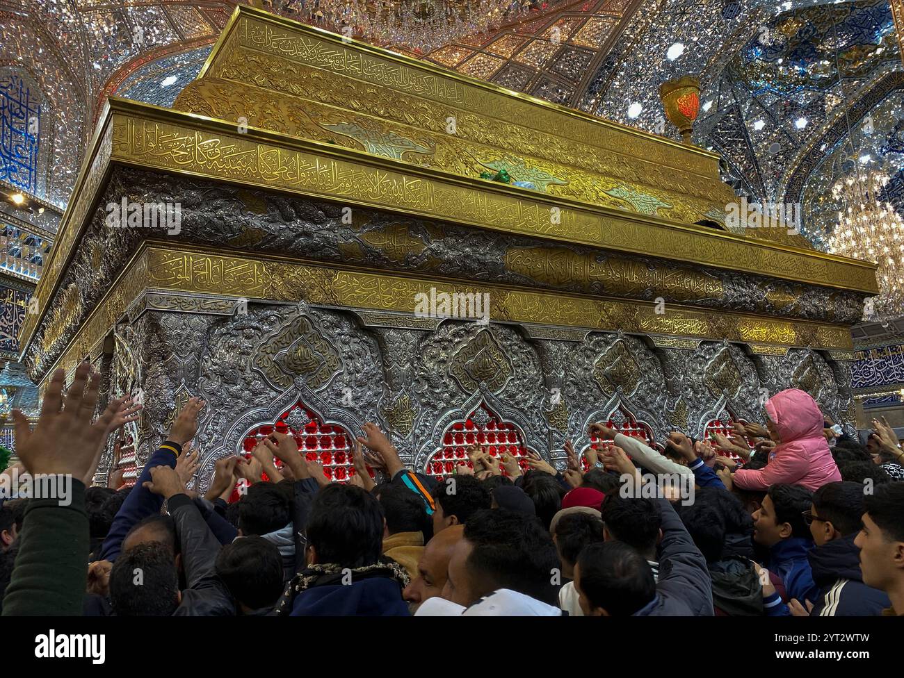 Shiite Muslim pilgrims visit the holy shrine of Imam Hussein in Karbala ...